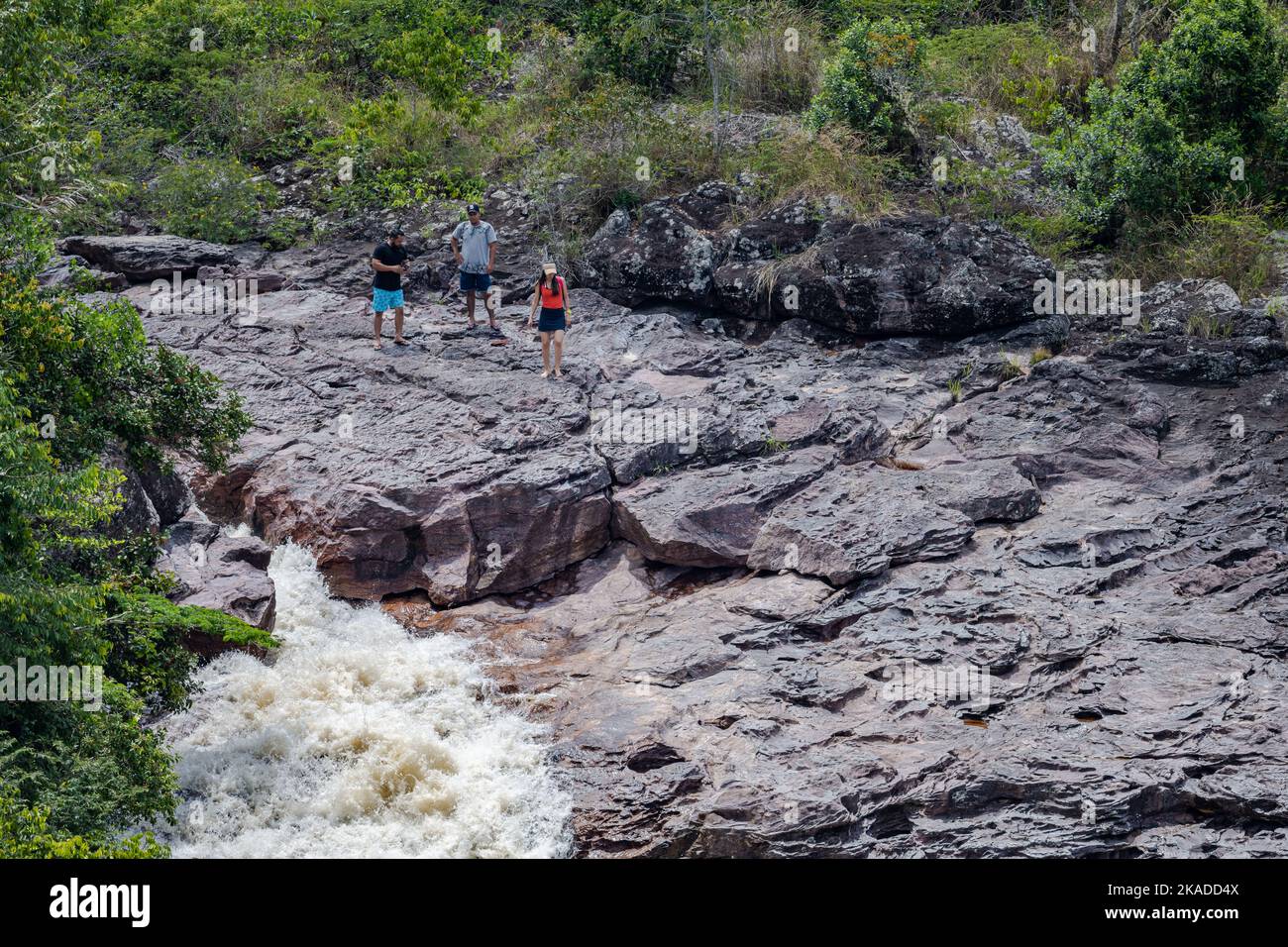 Local visitors enjoy the waterfall at the foot of Tepui mountain ...