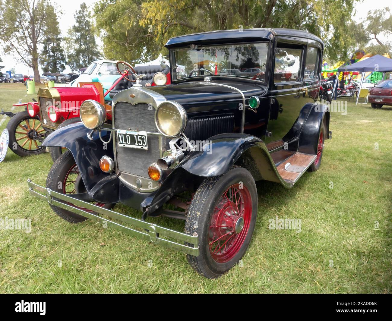 Old black Ford Model A Fordor sedan 1928 - 1931. Nature green grass and ...