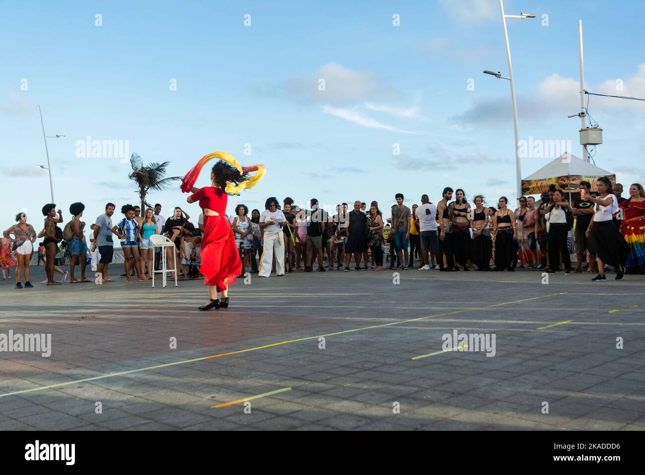 A dancer performing street belly dancing at Farol da Barra square in ...