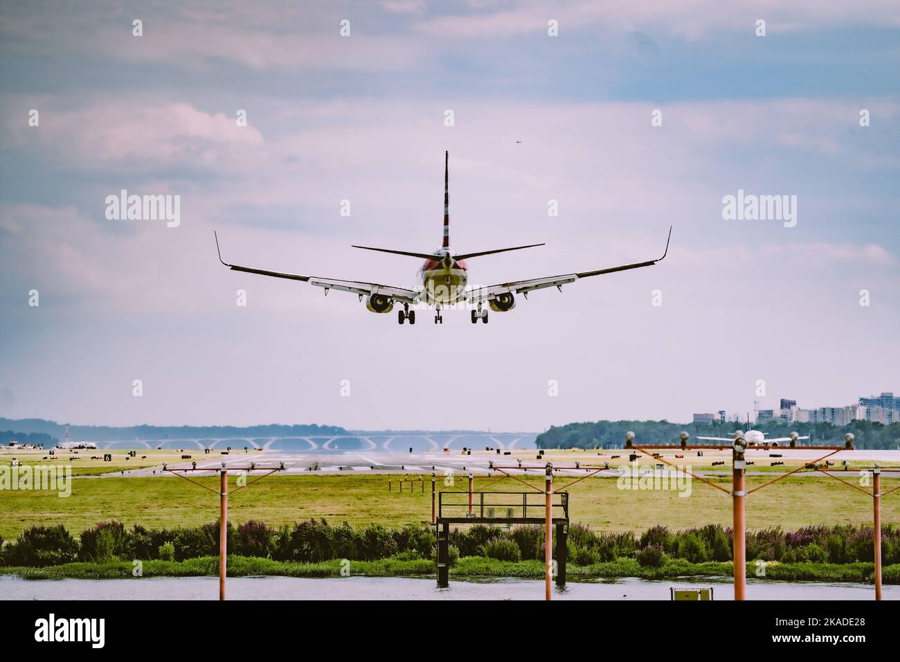An airplane preparing for landing at the airport Stock Photo - Alamy