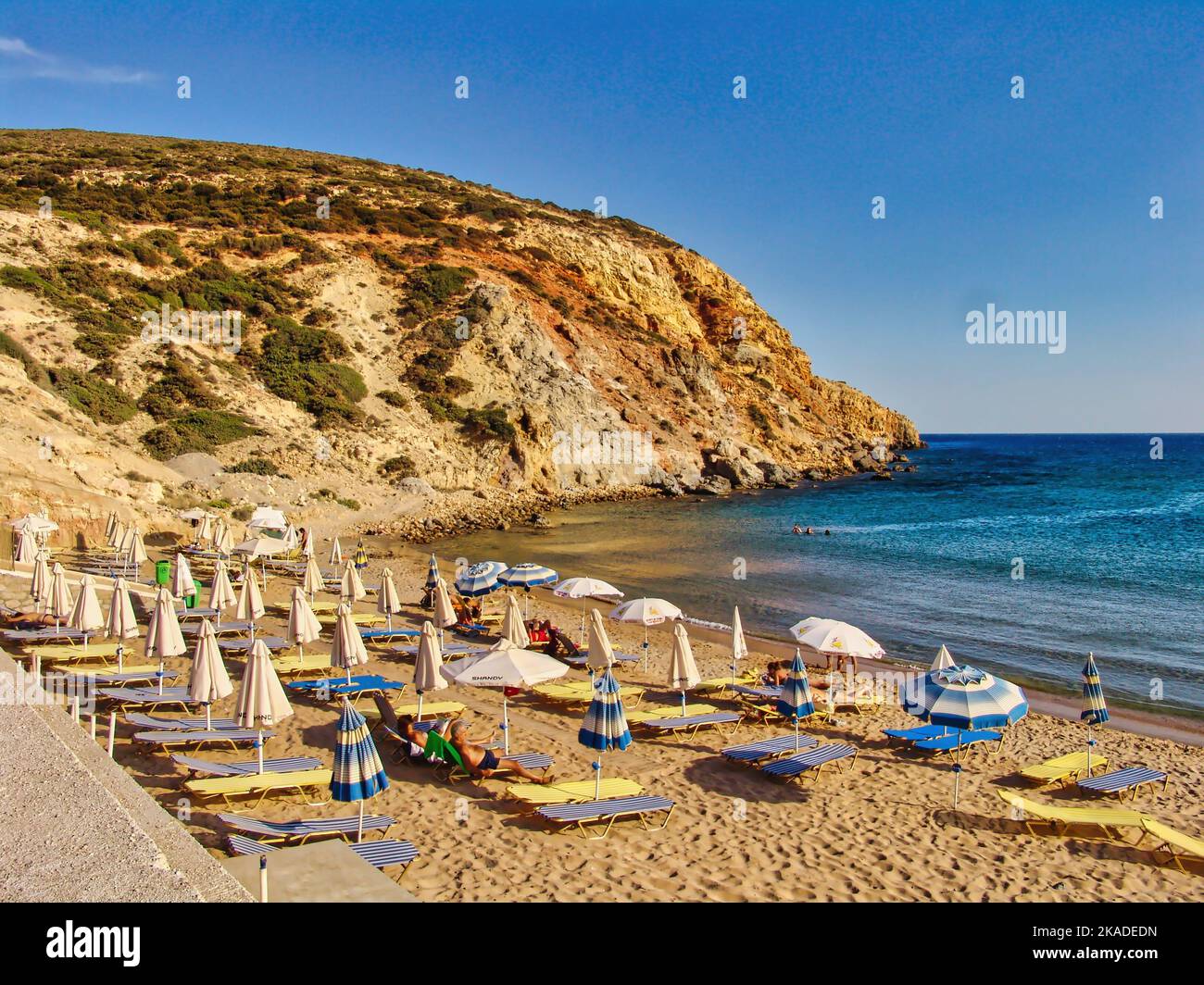 A beautiful scene of empty umbrella beaches on the island of Milos ...