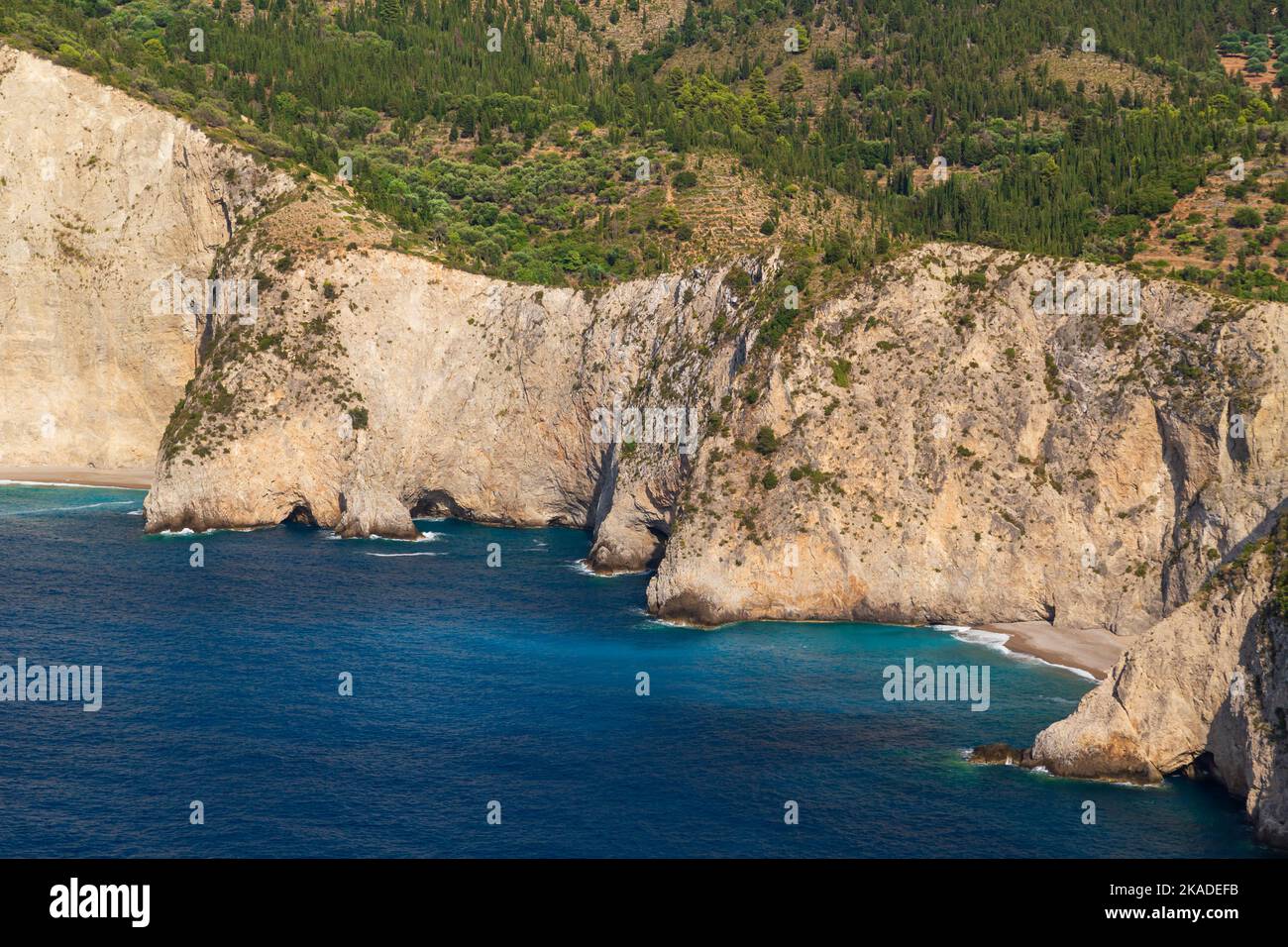 Top close up view at Assos peninsula cliffs and blue Ionian Sea water ...