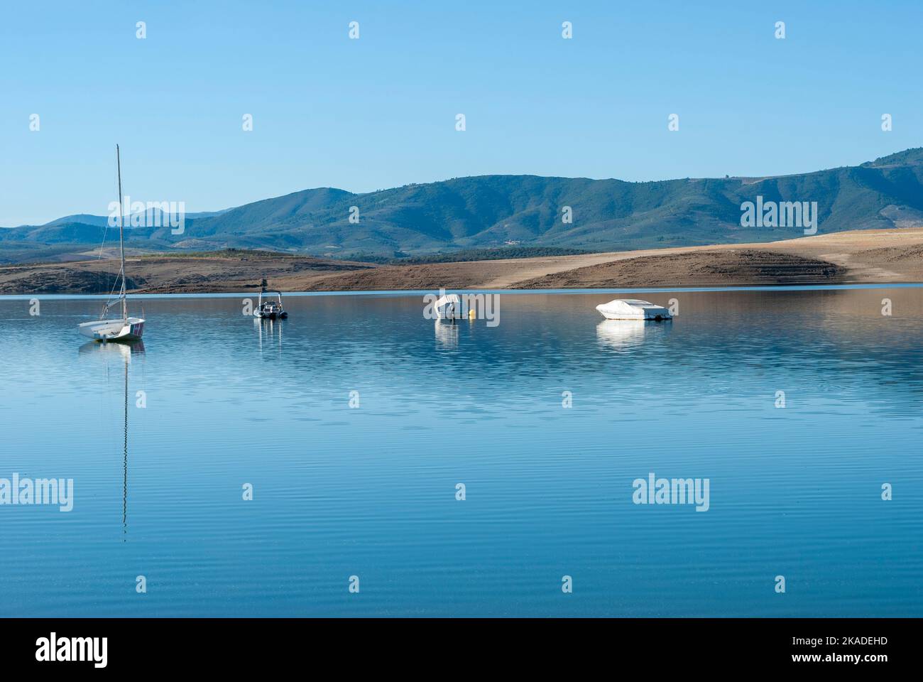 boat and sailboats in swamp on sunny day blue sky horizontal ...