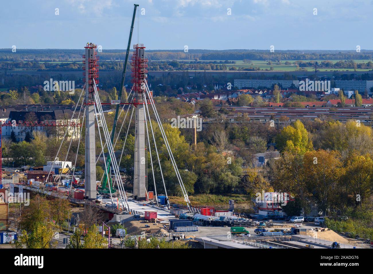 Magdeburg, Germany. 02nd Nov, 2022. A crane stands behind the pylons of ...