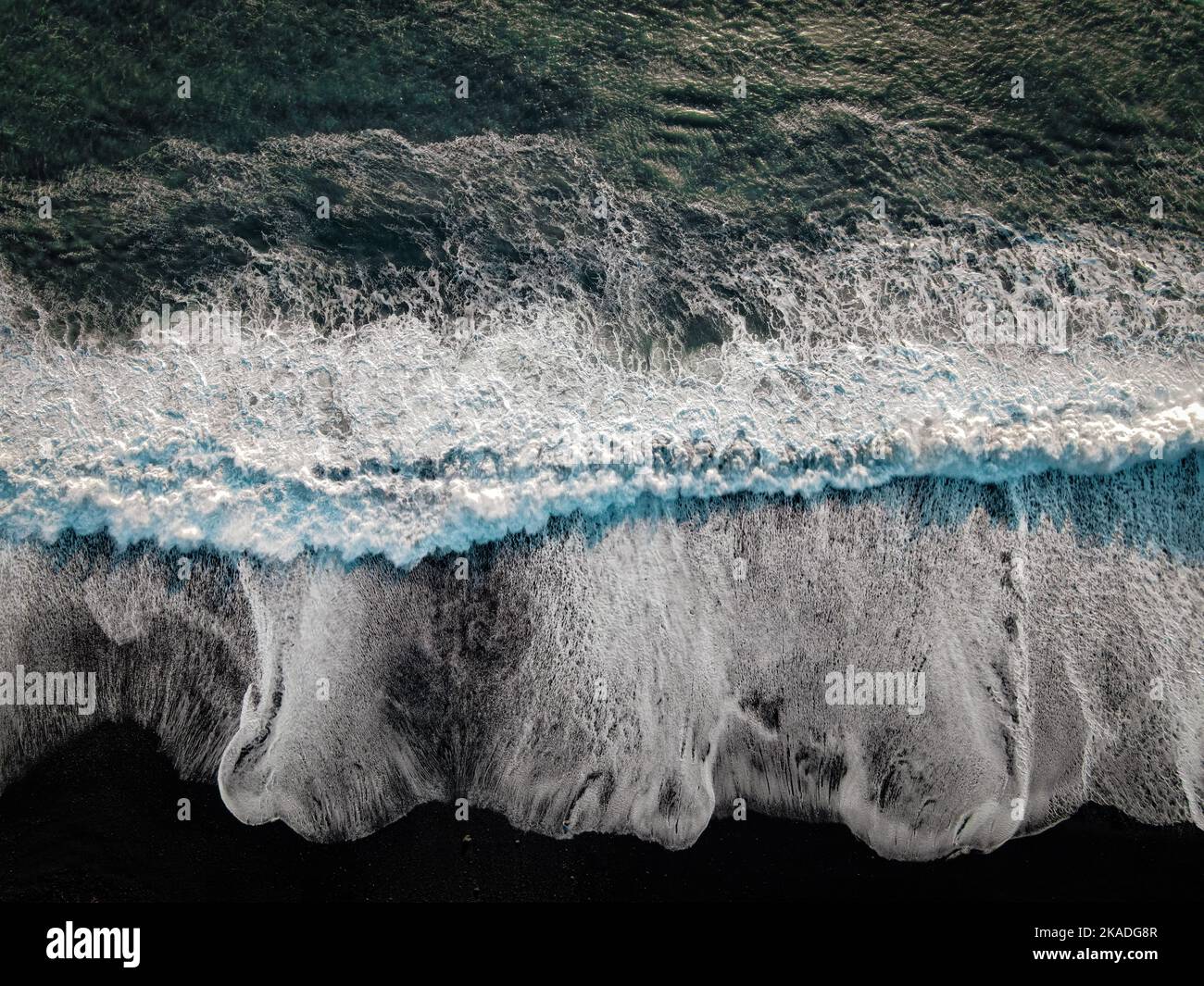 An aerial top view of waves and foam in a sea Stock Photo - Alamy