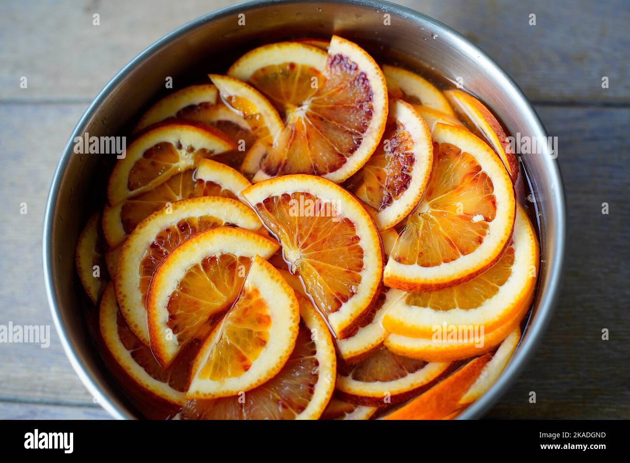 A top view of sliced orange in a pot with water Stock Photo - Alamy
