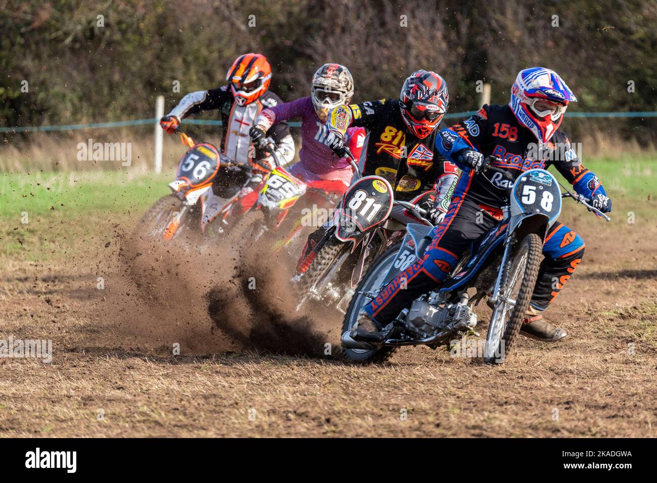 Riders racing in grasstrack motorcycle race. Donut Meeting event ...