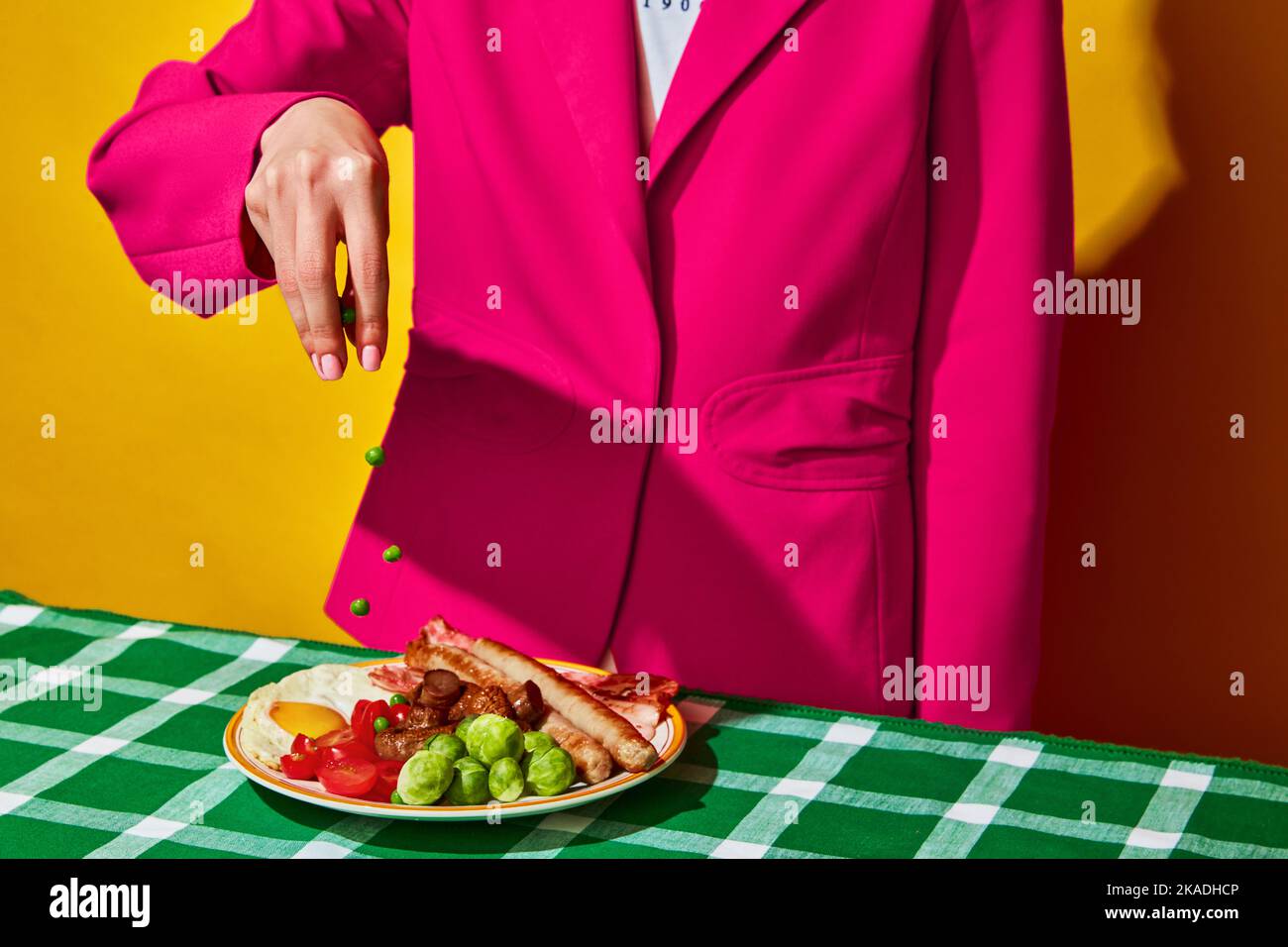 Woman cooking fried eggs, English breakfast on plate on green ...