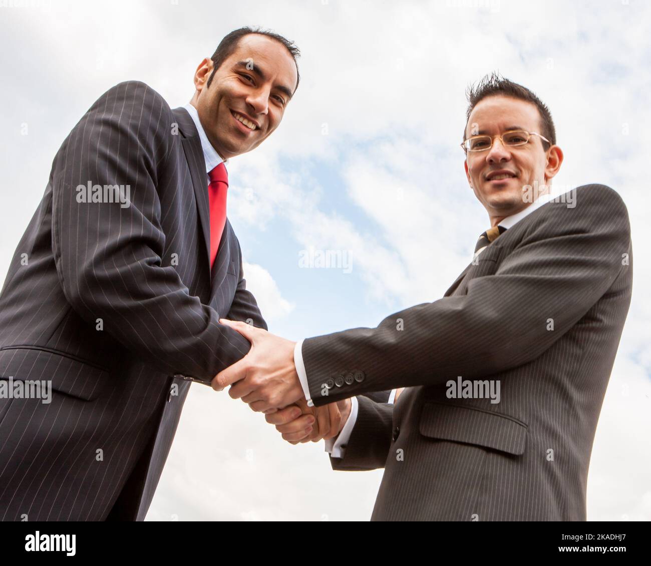 Business Handshake. A warm and friendly handshake between agreeable ...