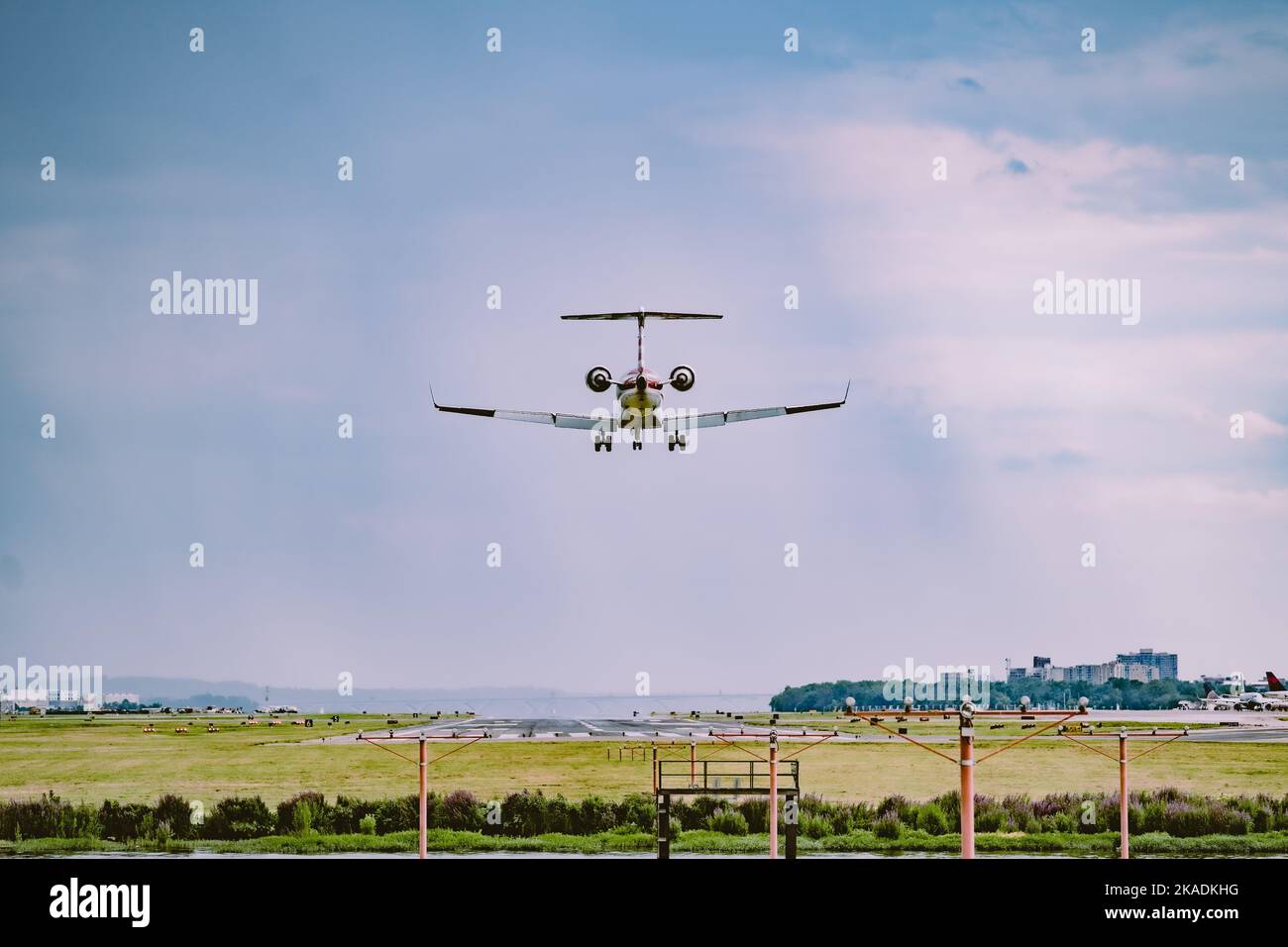 An airplane preparing for landing at the airport Stock Photo - Alamy