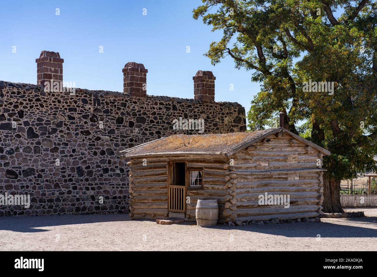 Original log bunkhouse outside the wall of the Cove Creek Ranch Fort ...