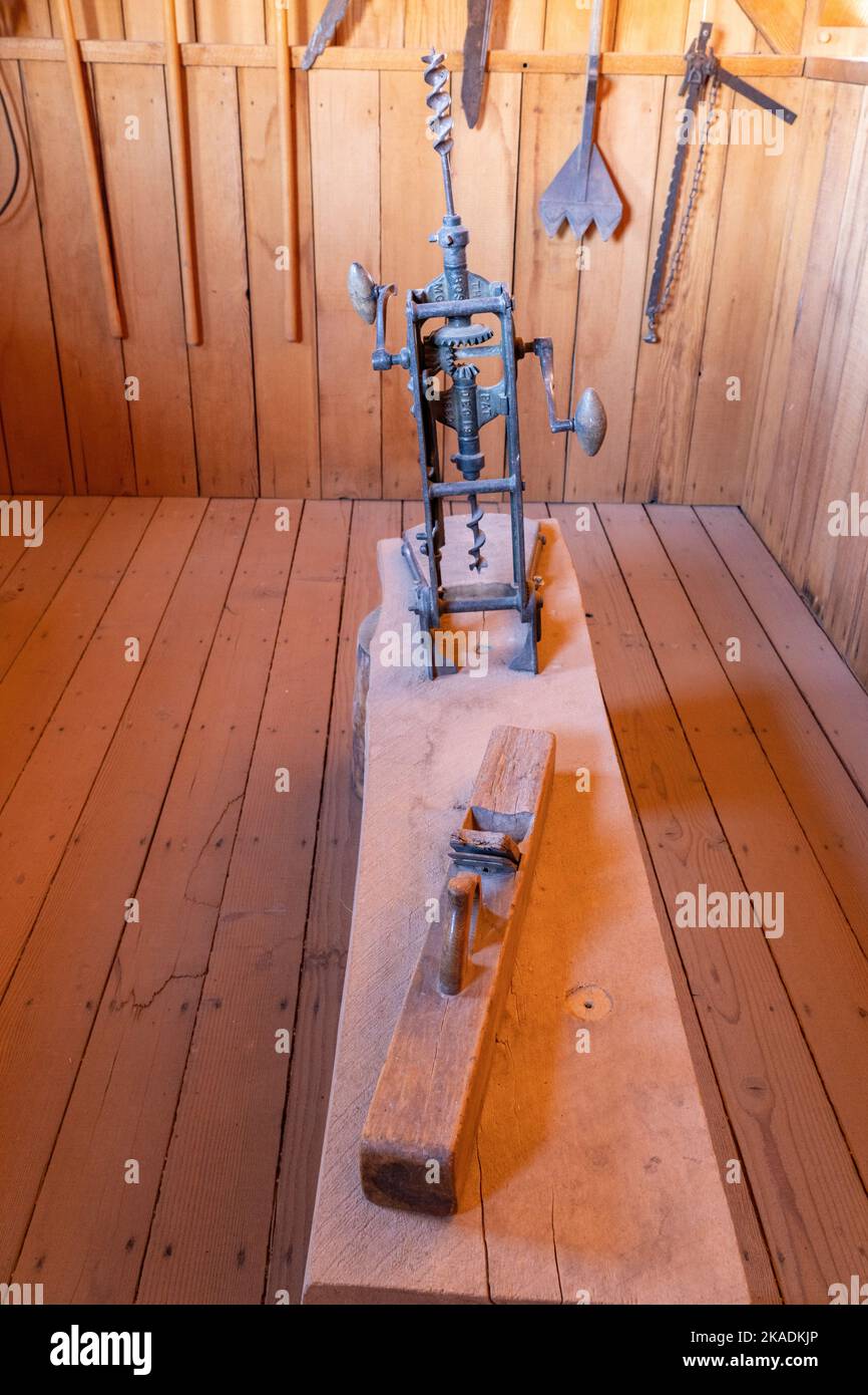 Antique tools, a wood plane & drill press, in the barn of the pioneer ...