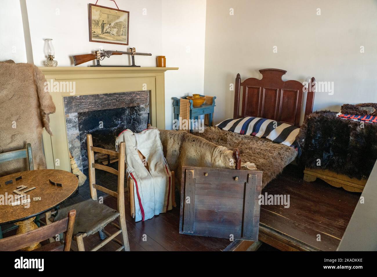 Dominos on a table & elk hides & a buffalo hide in a lodging room of ...