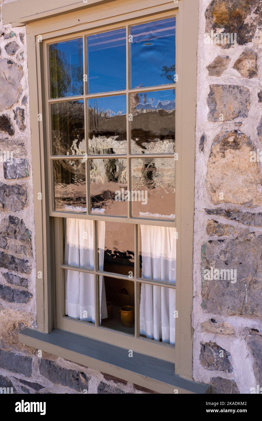 Original vintage glass window in a lodging room of the Cove Creek Ranch ...