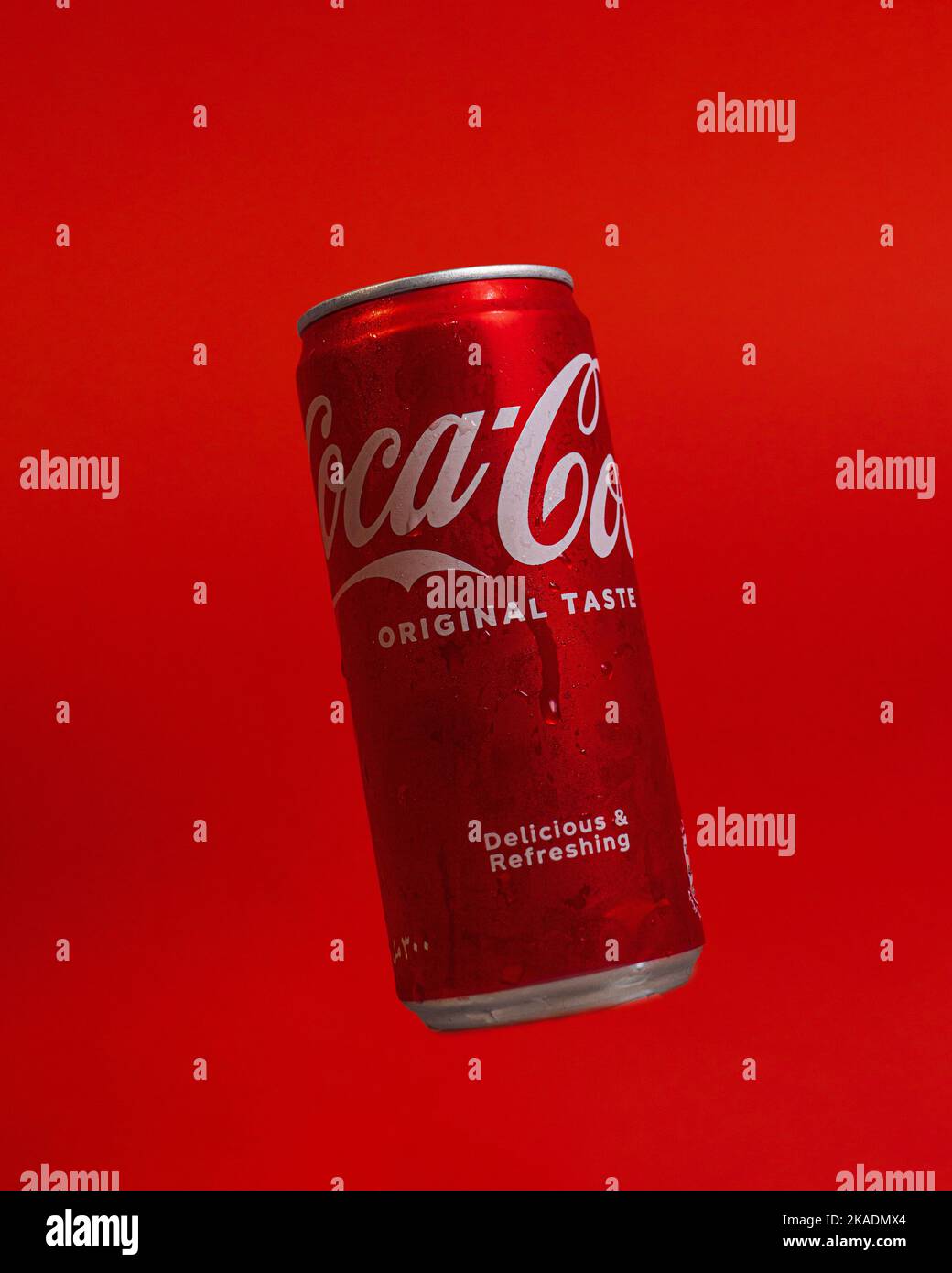 A closeup of Coca cola can under a light Stock Photo - Alamy