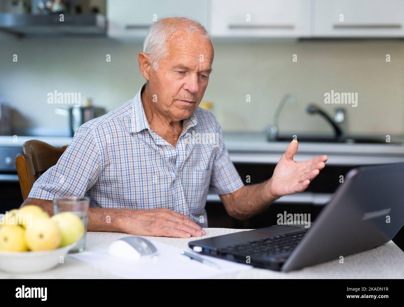 Senior man talking via video call Stock Photo - Alamy