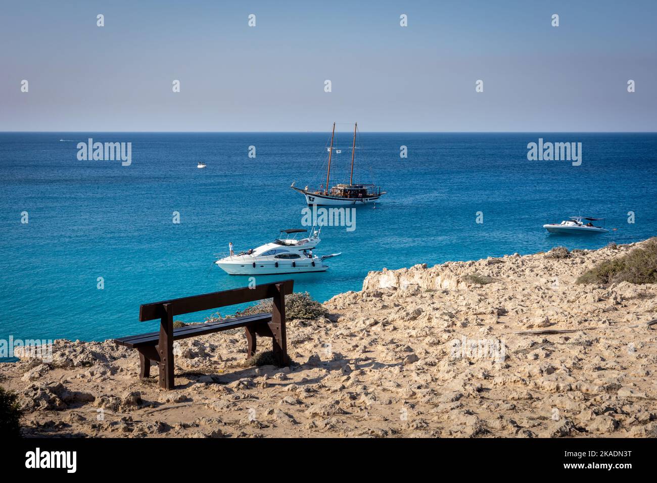 Empty wooden bench on the cliff with a view to the sea at Blue Lagoon ...