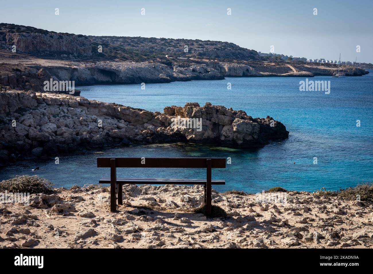 Empty wooden bench on the cliff with a view to the sea at Blue Lagoon ...