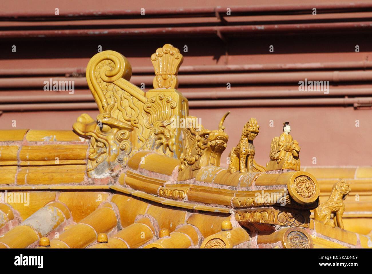 The roof detail of the ancient temple with dragon sculptures on a sunny ...