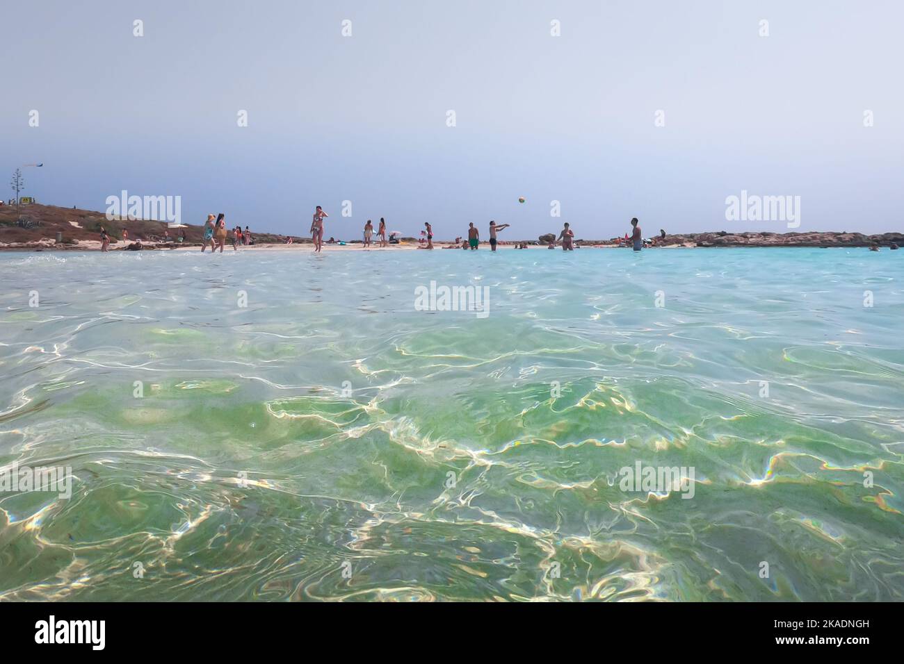 Turquoise water and golden sand at Nissi beach, Cyprus. People bathing ...