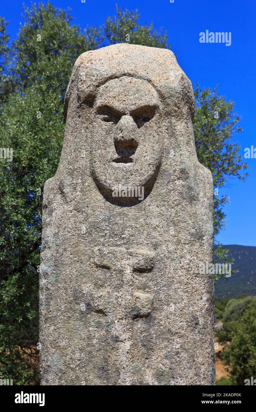 Close-up of a menhir with a carved human face at the megalithic site of ...