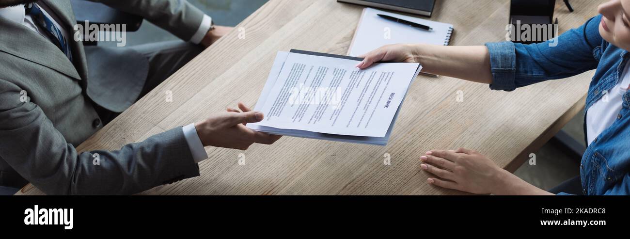 Top view of businessman and woman holding resume on job interview in ...