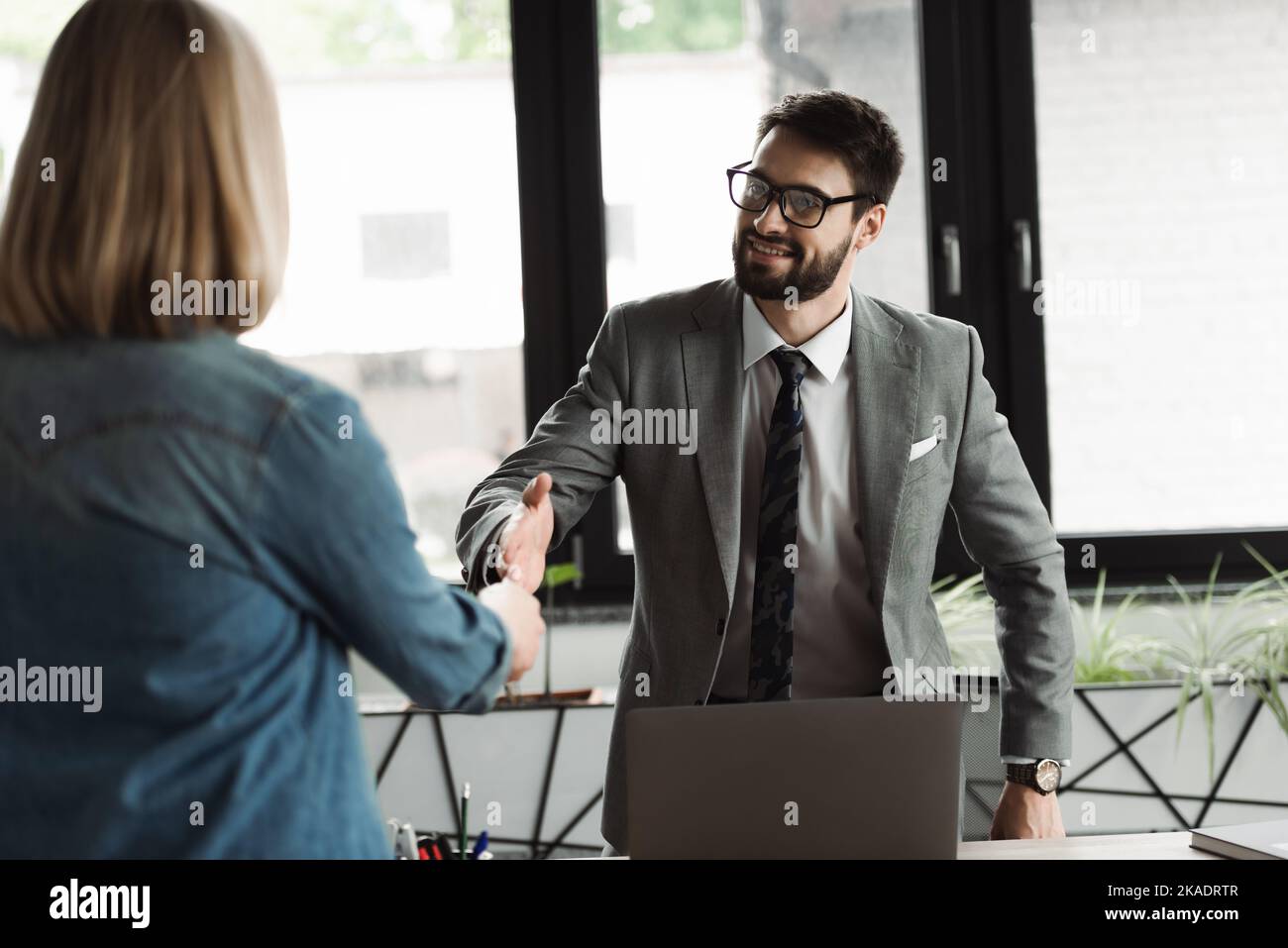 Job interview man woman young handshake hi-res stock photography and ...