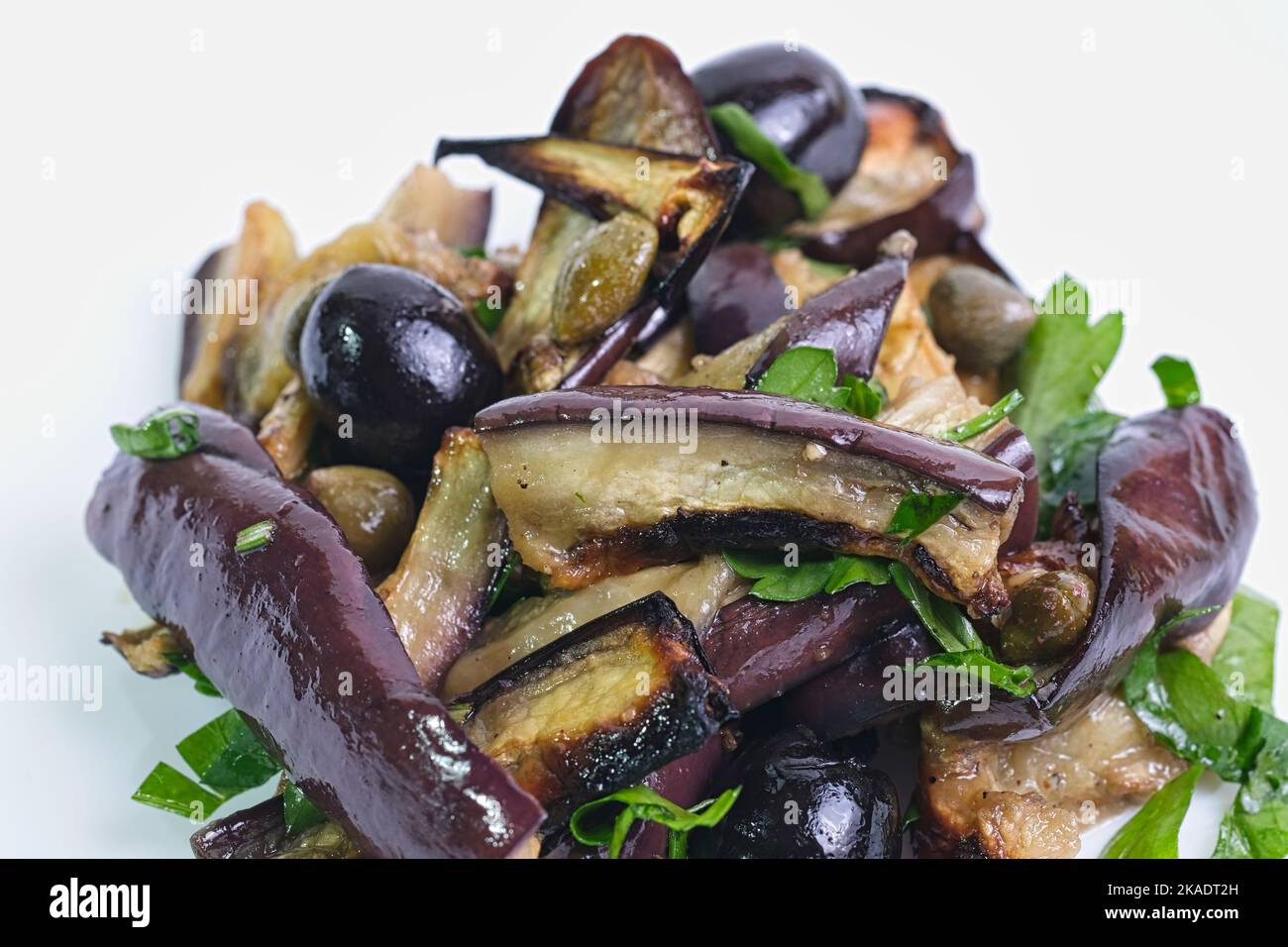 closeup on fried eggplant with capers and black olives ,mediterranean ...