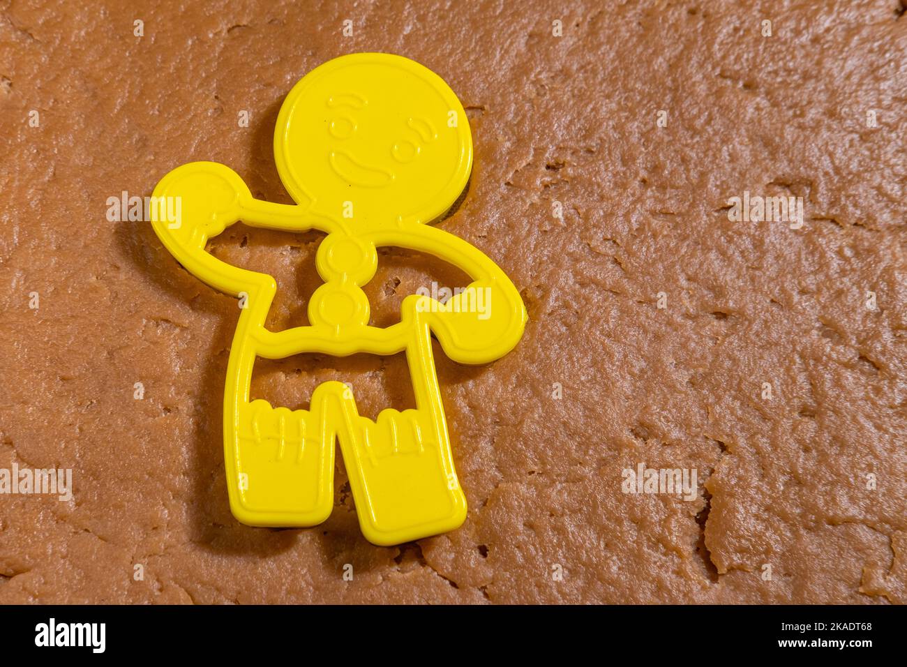 Yellow Gingerbread Man shape for cutting out raw gingerbread dough ...
