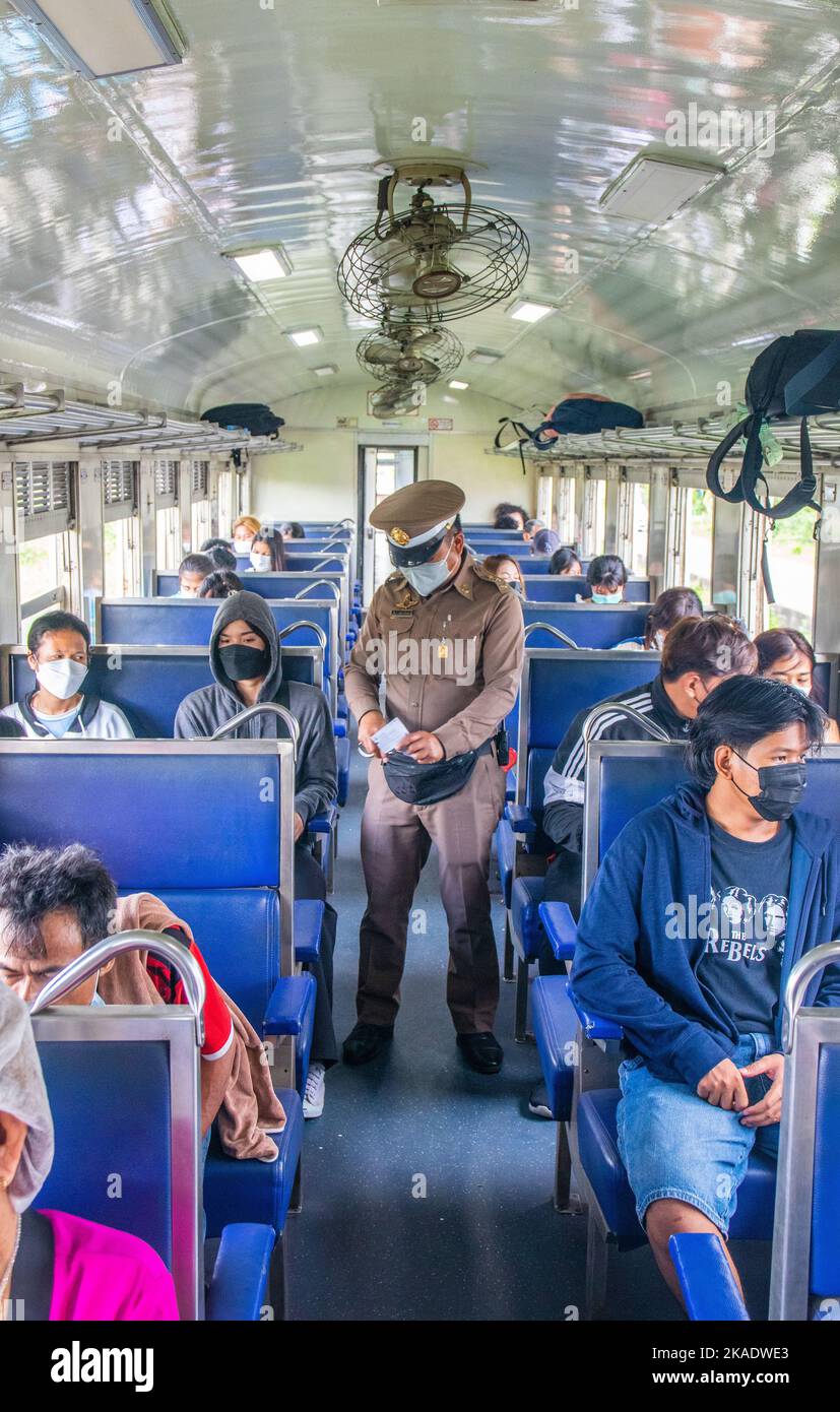 People and a conductor in a train wagon in Thailan Stock Photo - Alamy