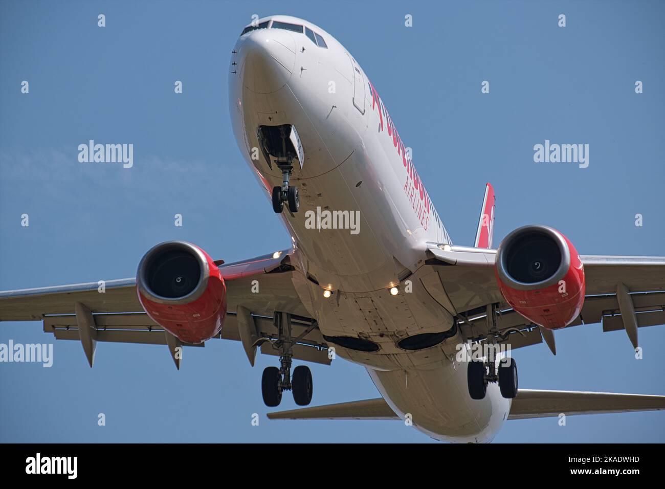 passenger plane on approach for landing, lower front view Stock Photo ...