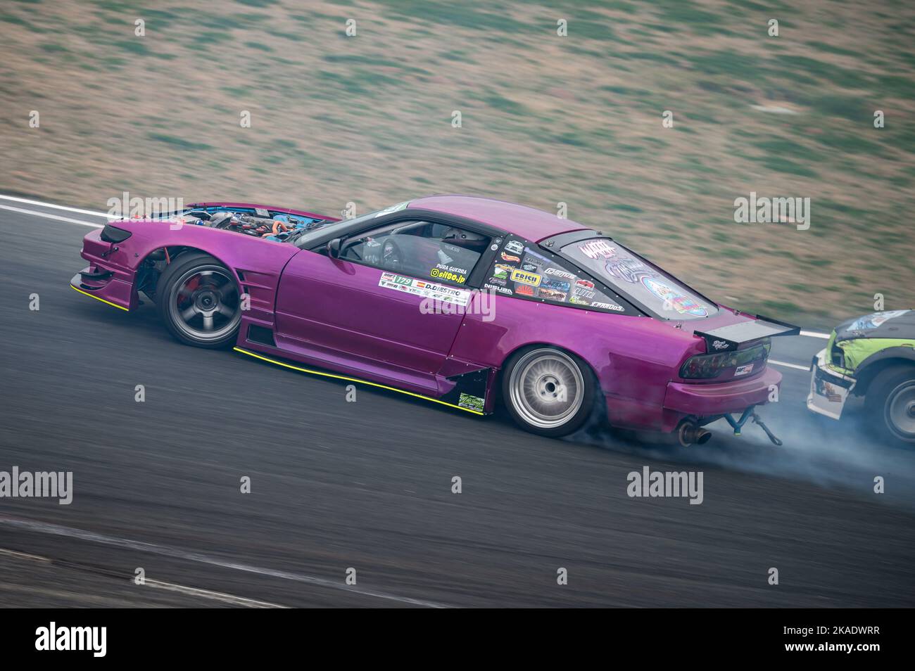 Nissan Silvia S13 Sileighty in purple drifting on the race track Stock ...