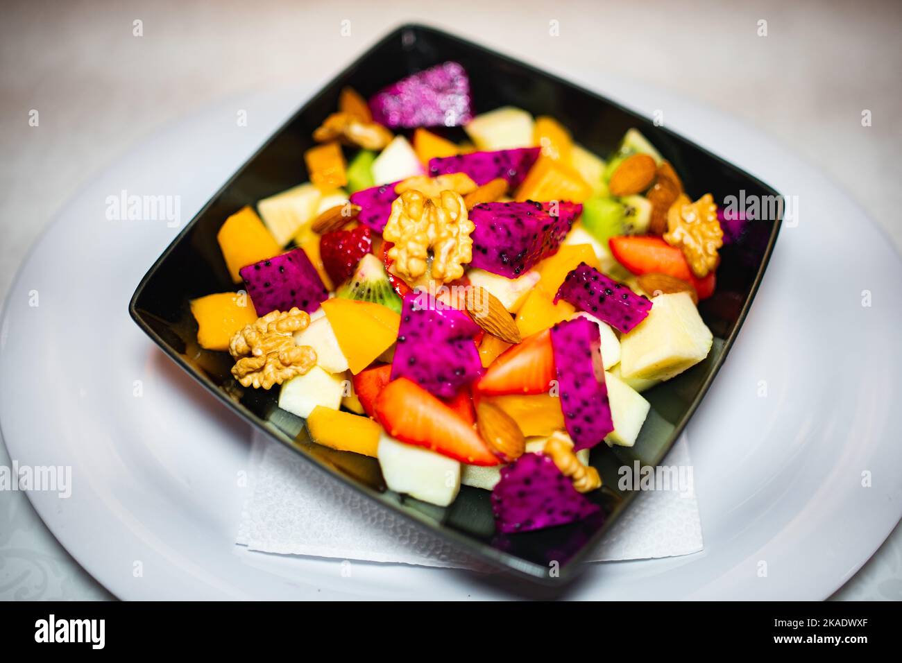 Bowl of various fruits sliced into pieces Stock Photo - Alamy