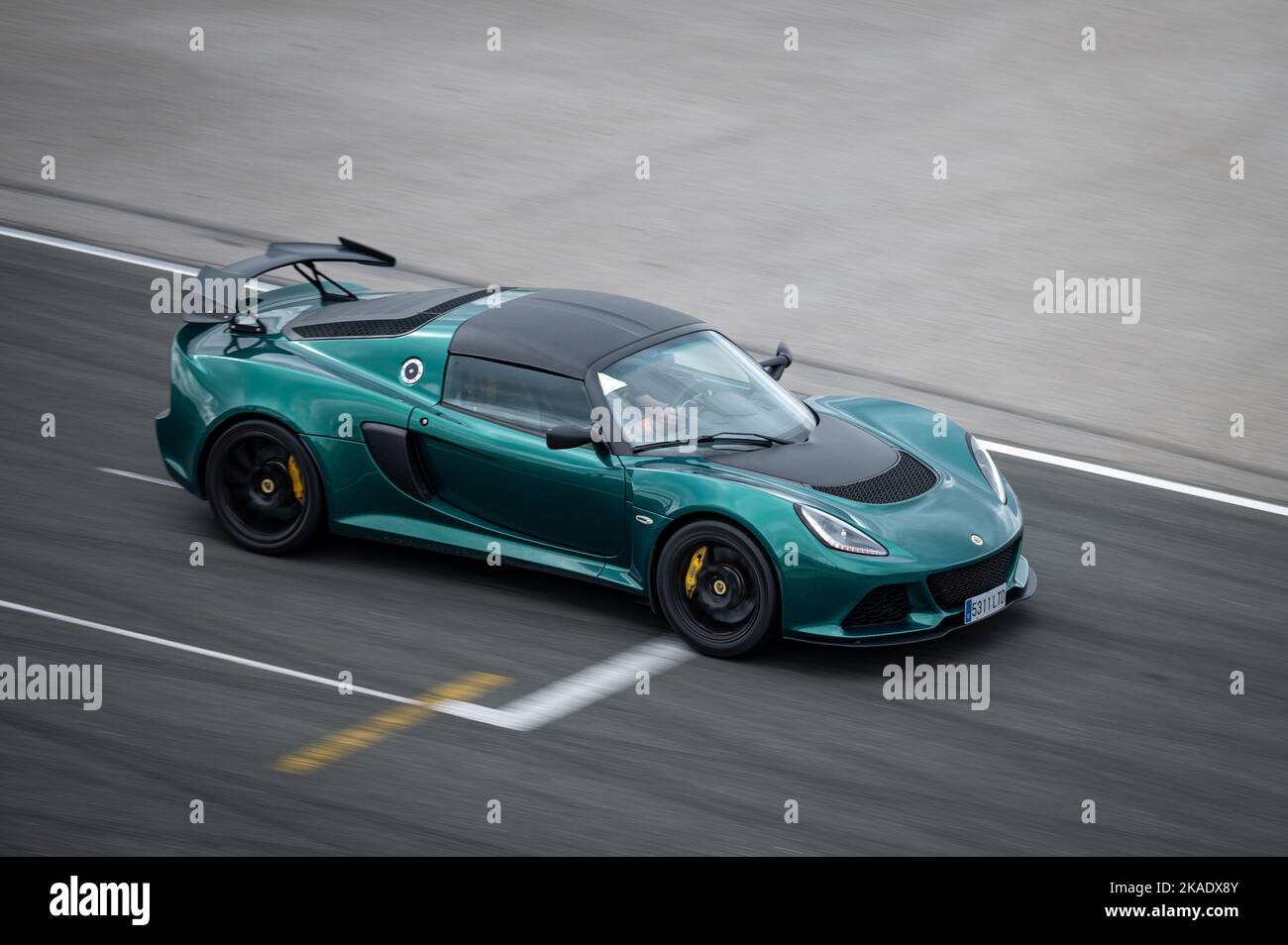 Lotus Exige racing around the race circuit Stock Photo - Alamy