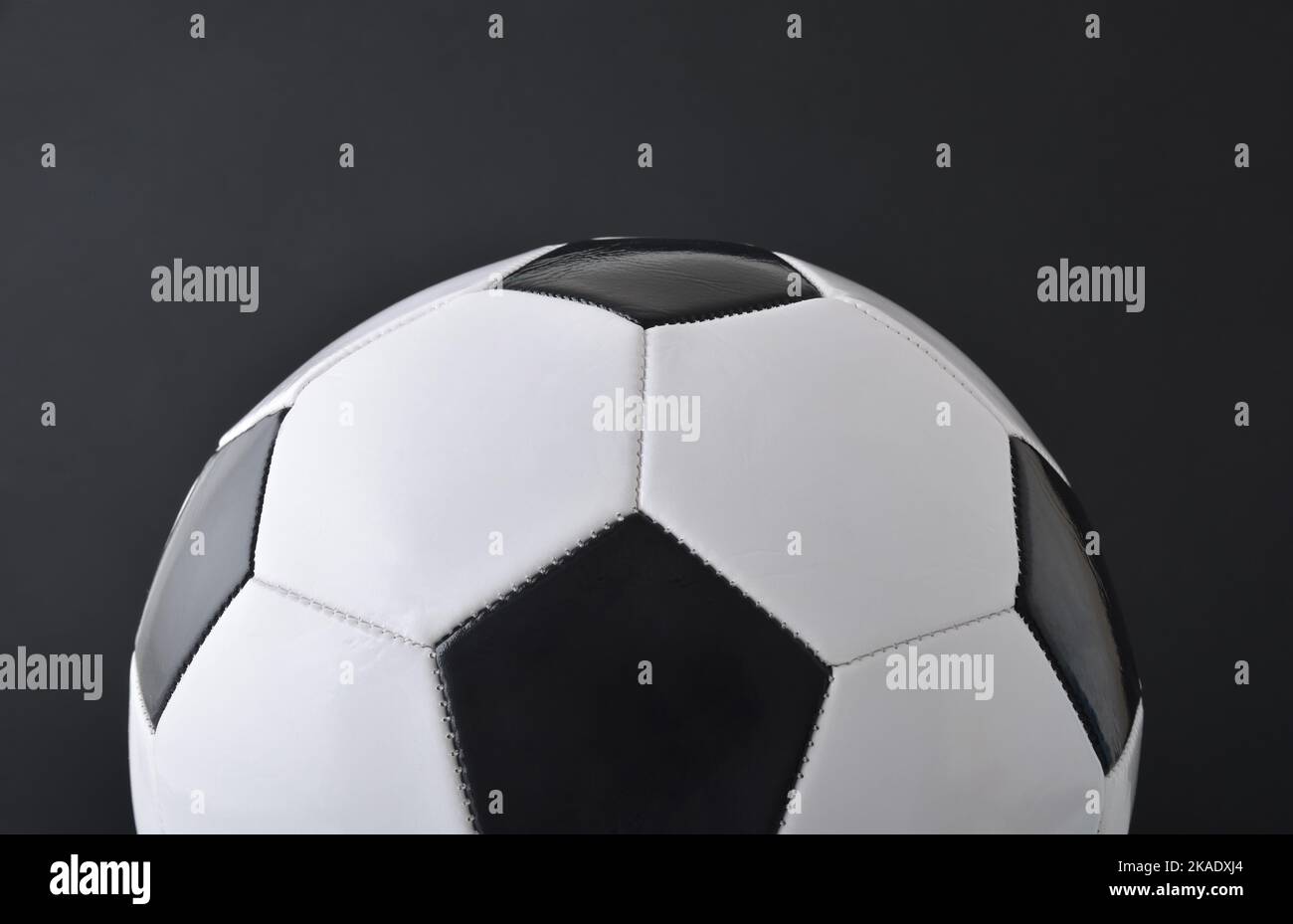 Detail view of half classic black and white leather soccer ball ...
