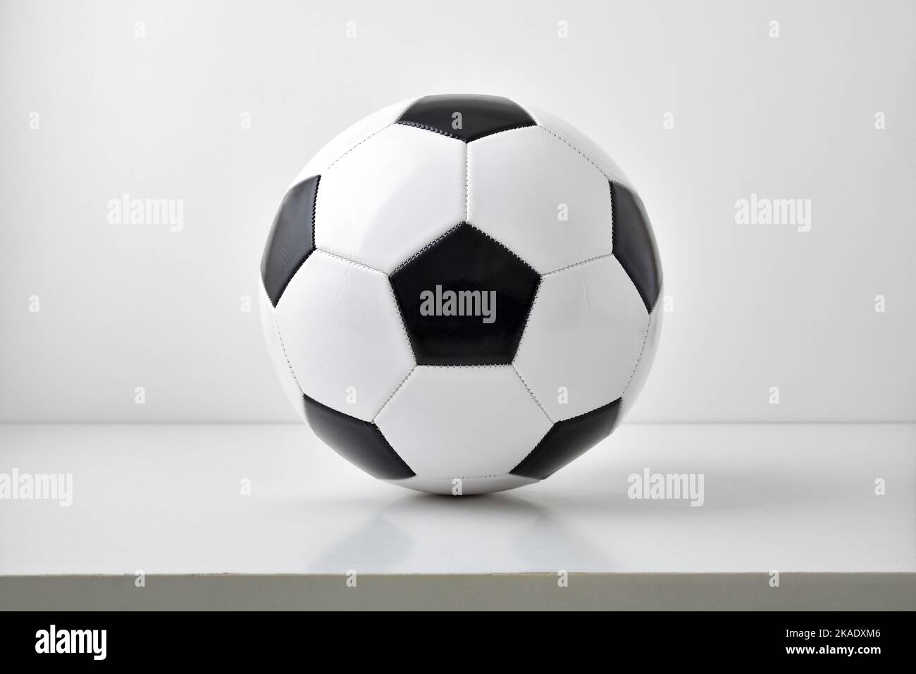Detail view of classic black and white leather soccer ball center and ...
