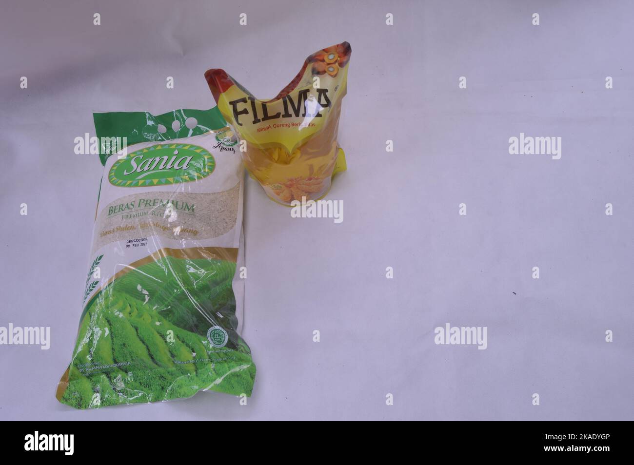 Packaged rice and cooking oil on a white background Stock Photo - Alamy