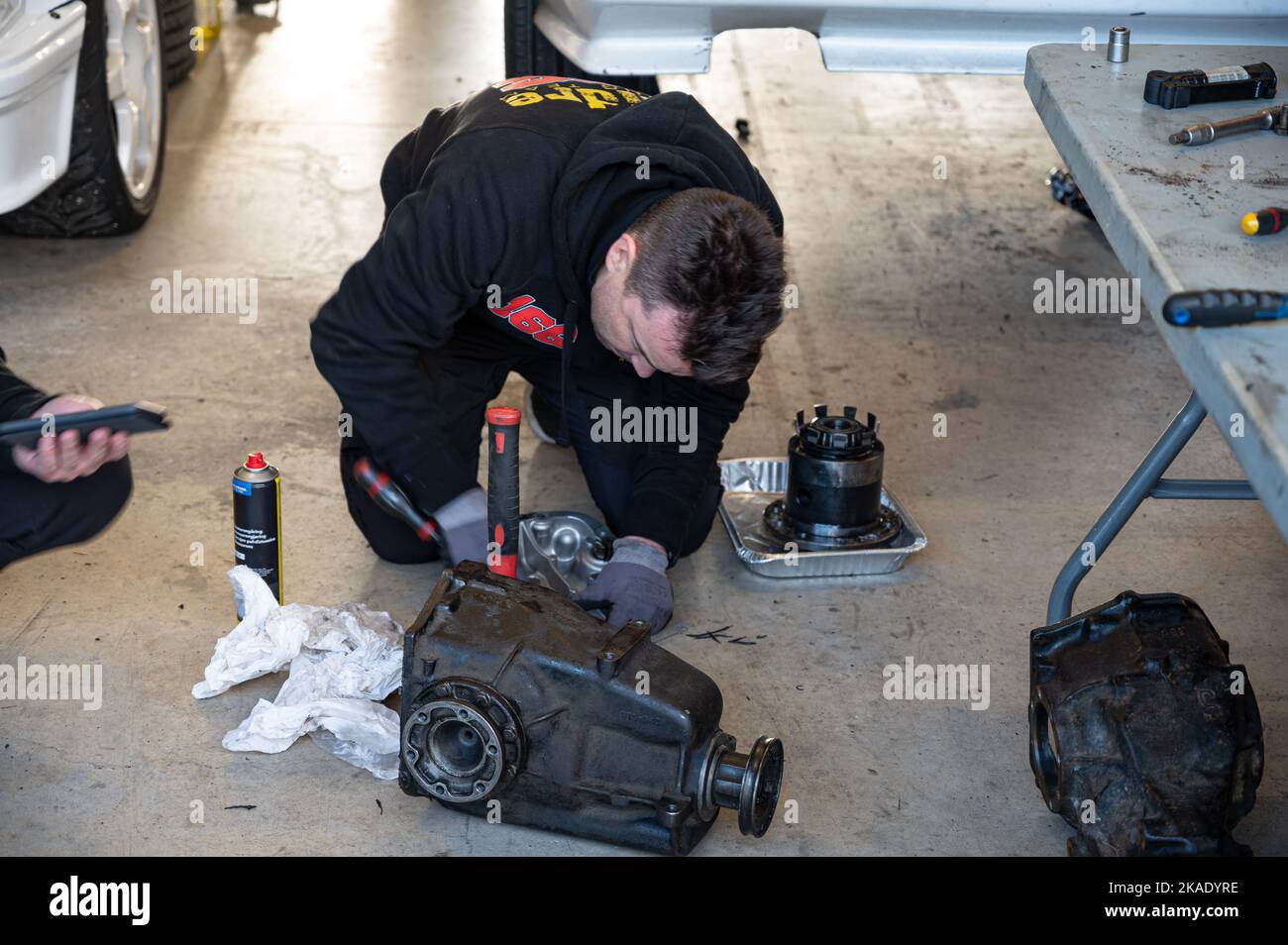 A mechanic is repairing a race car Stock Photo - Alamy