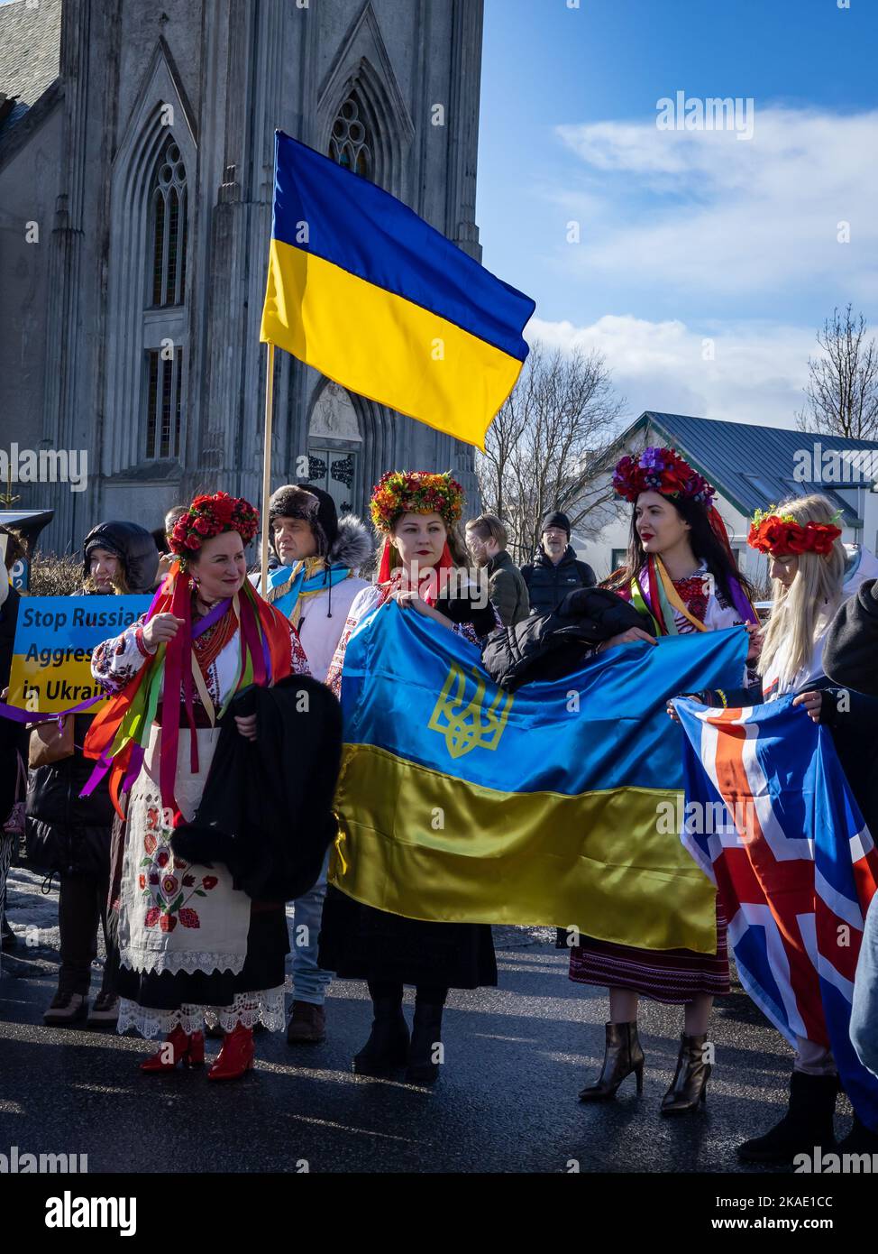 Reykjavik, Iceland - March 13, 2022: People carrying ukrainian colours ...