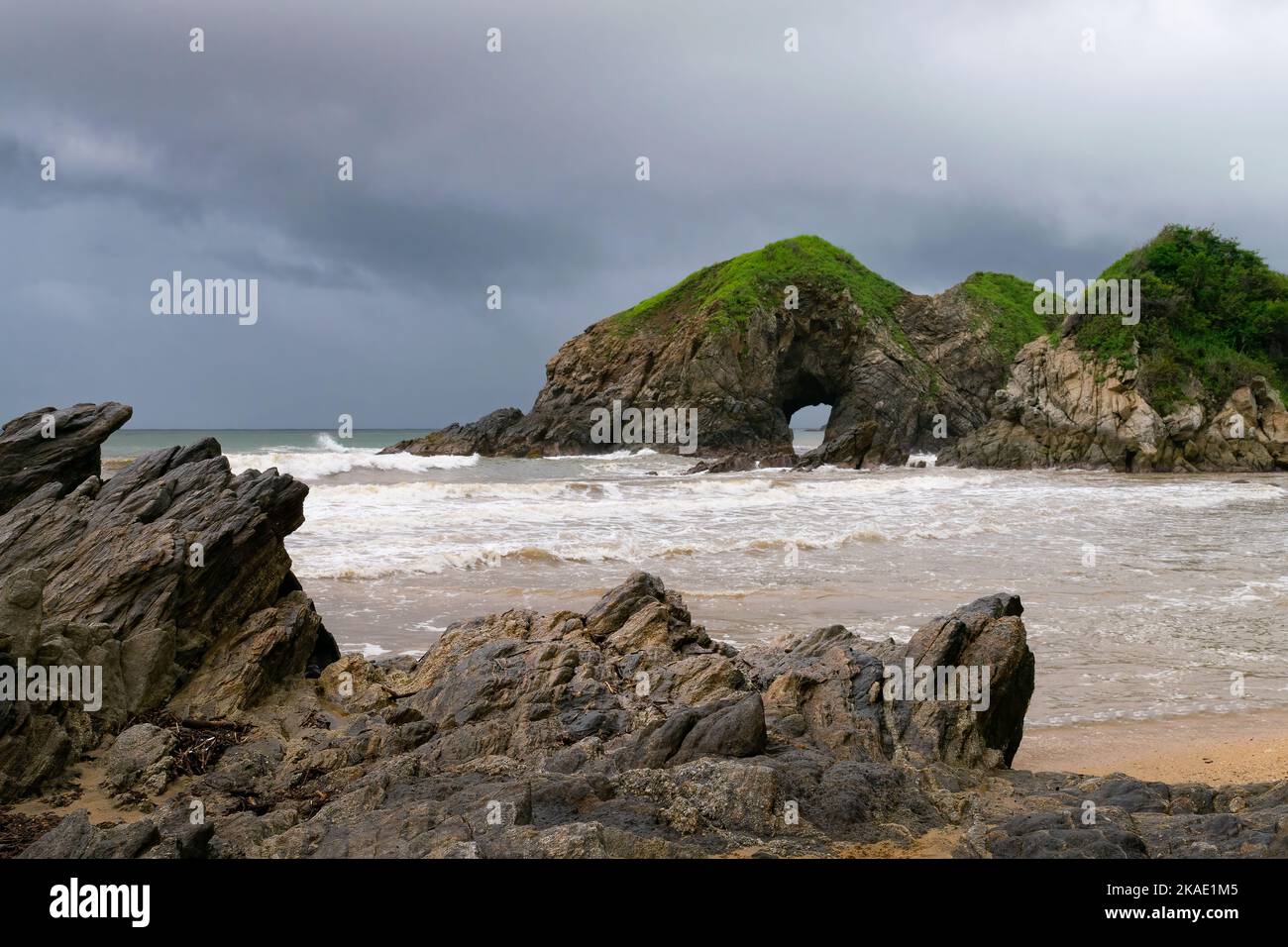A beautiful view of the natural arch in Zipolite beach, Mexico Stock ...
