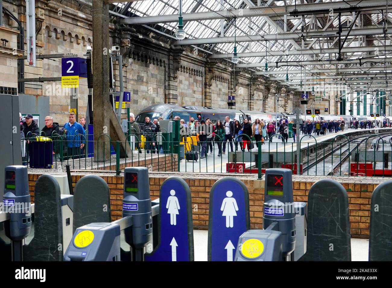Large crowd of people rushing off the platform after arriving at ...