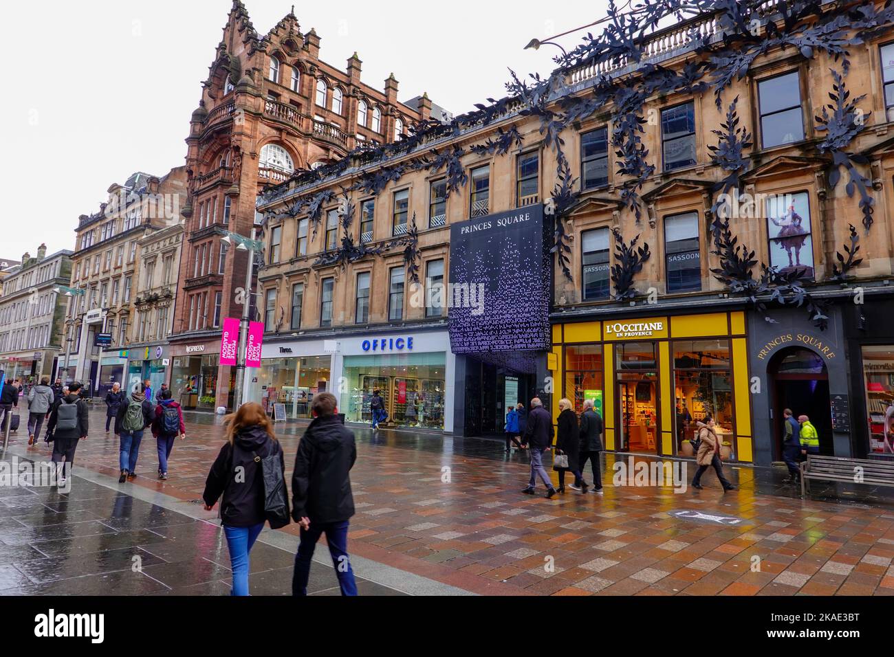 People walking, shopping, on Buchanan St at Princes Square on a damp ...