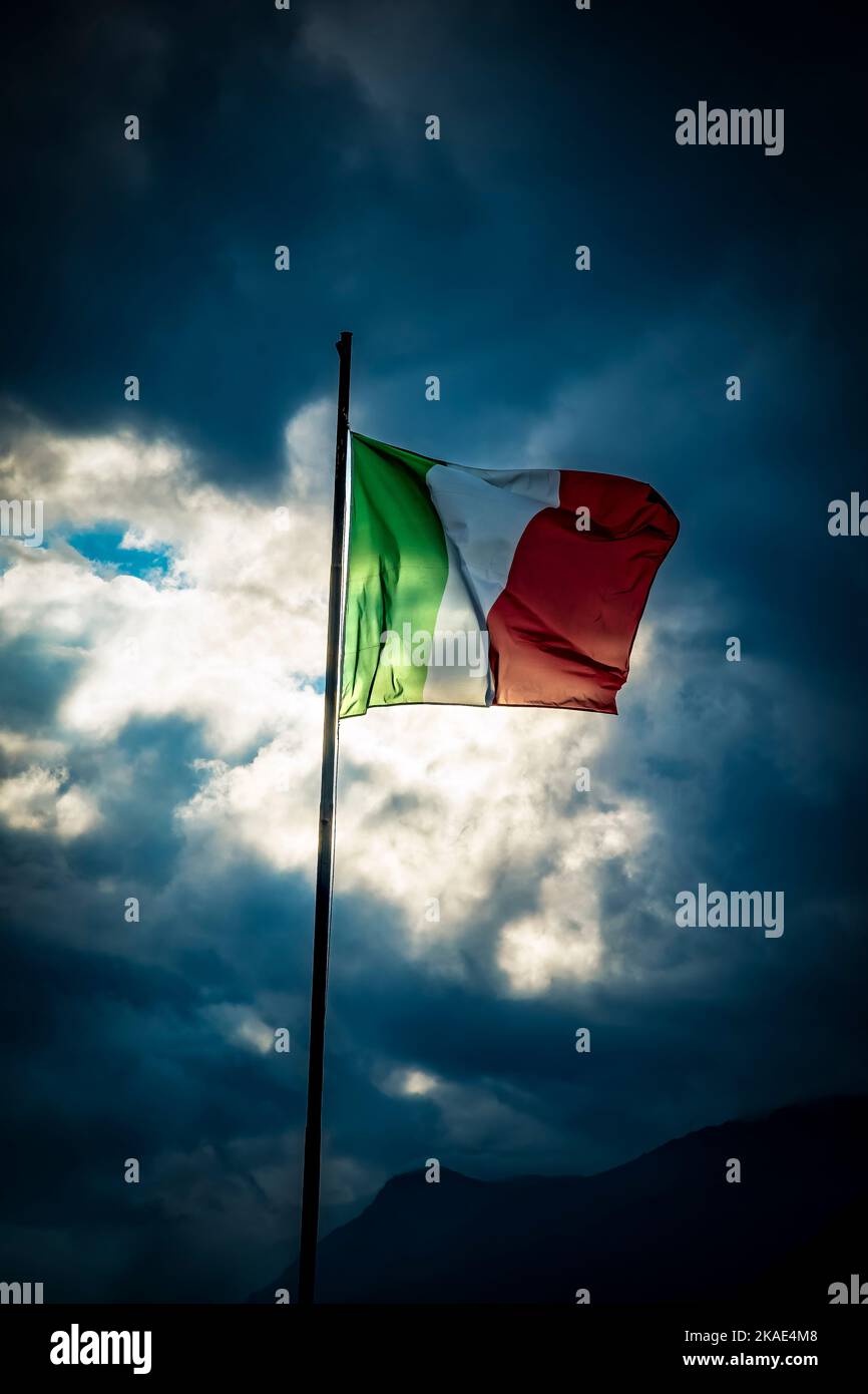 Italian national flag against backdrop of dramatic sky Stock Photo - Alamy