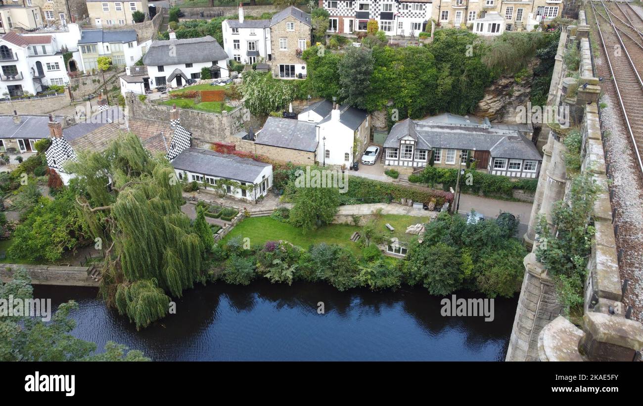 An aerial shot of a railway and river Ariel with houses view in ...