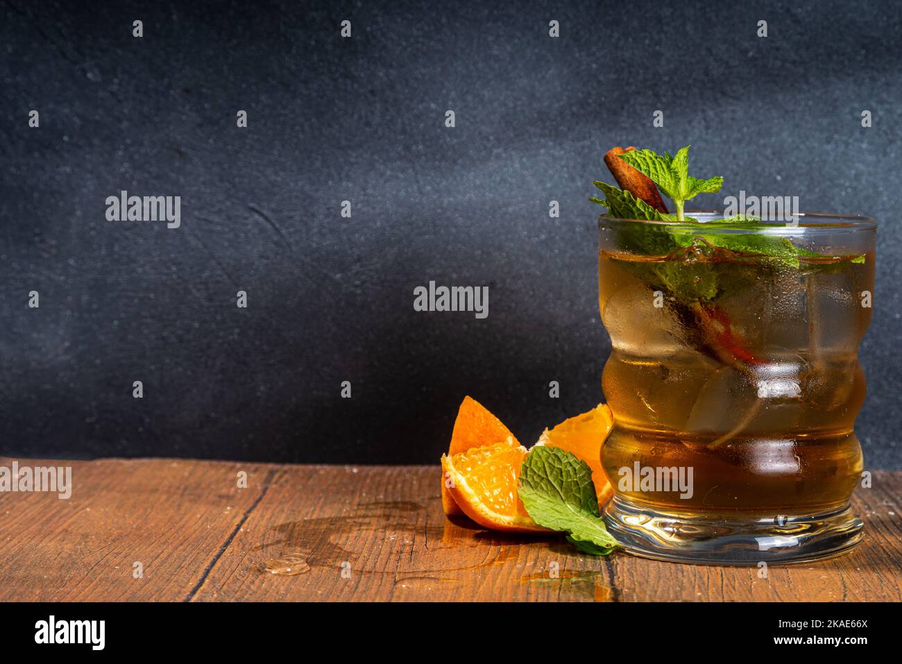 Autumn spicy booze alcohol drink, Tangerine Whiskey Smash cocktail with ...