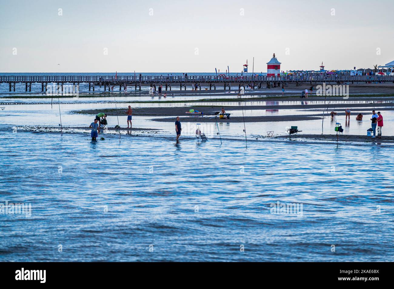 Towards the sunset. Marano lagoon late summer colors. Clouds and sun ...