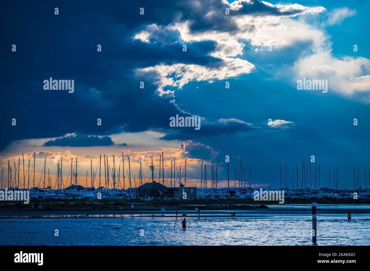 Towards the sunset. Marano lagoon late summer colors. Clouds and sun ...