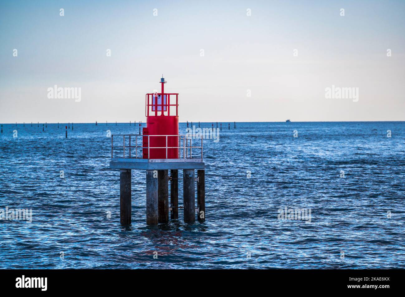Towards the sunset. Marano lagoon late summer colors. Clouds and sun ...