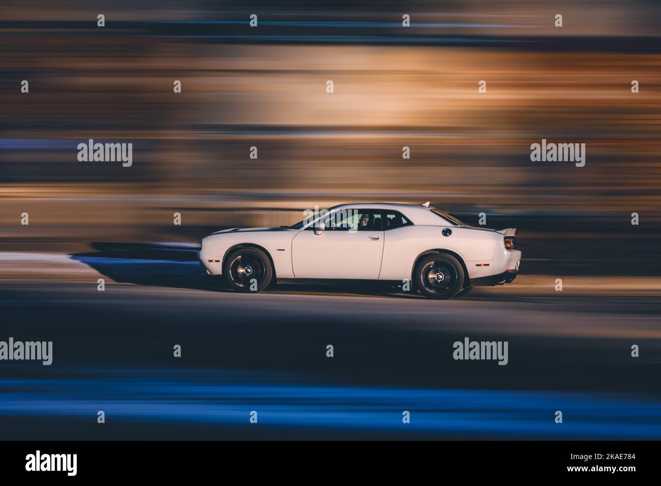 A male driving a white luxurious car on the highway - high speed Stock ...