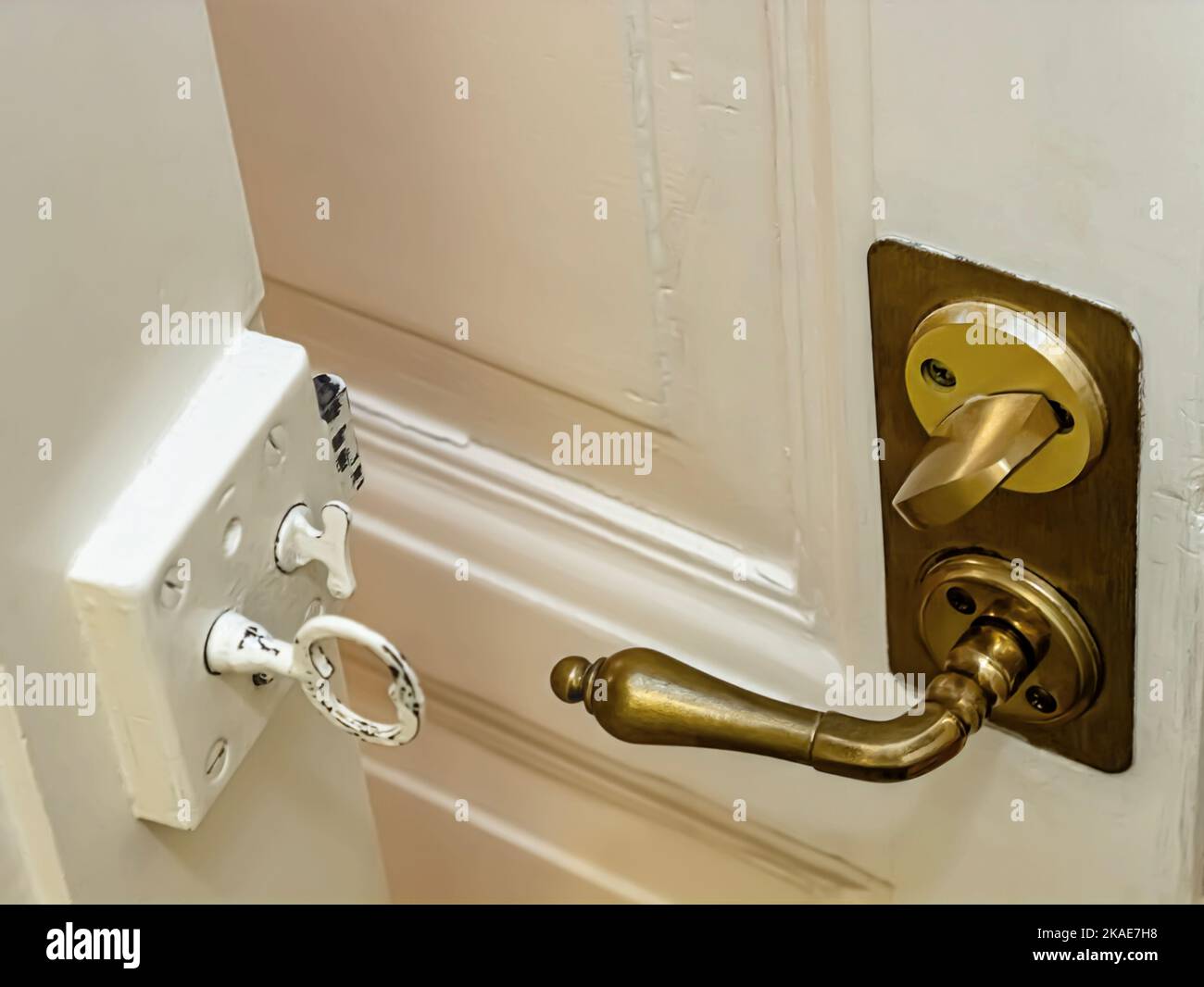 A rim lock and a mortice lock fitted on wood doors painted white Stock ...